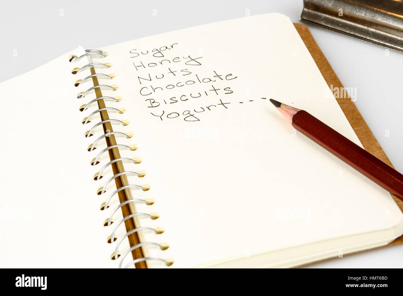 shopping list in the diary with pencil on white Stock Photo - Alamy
