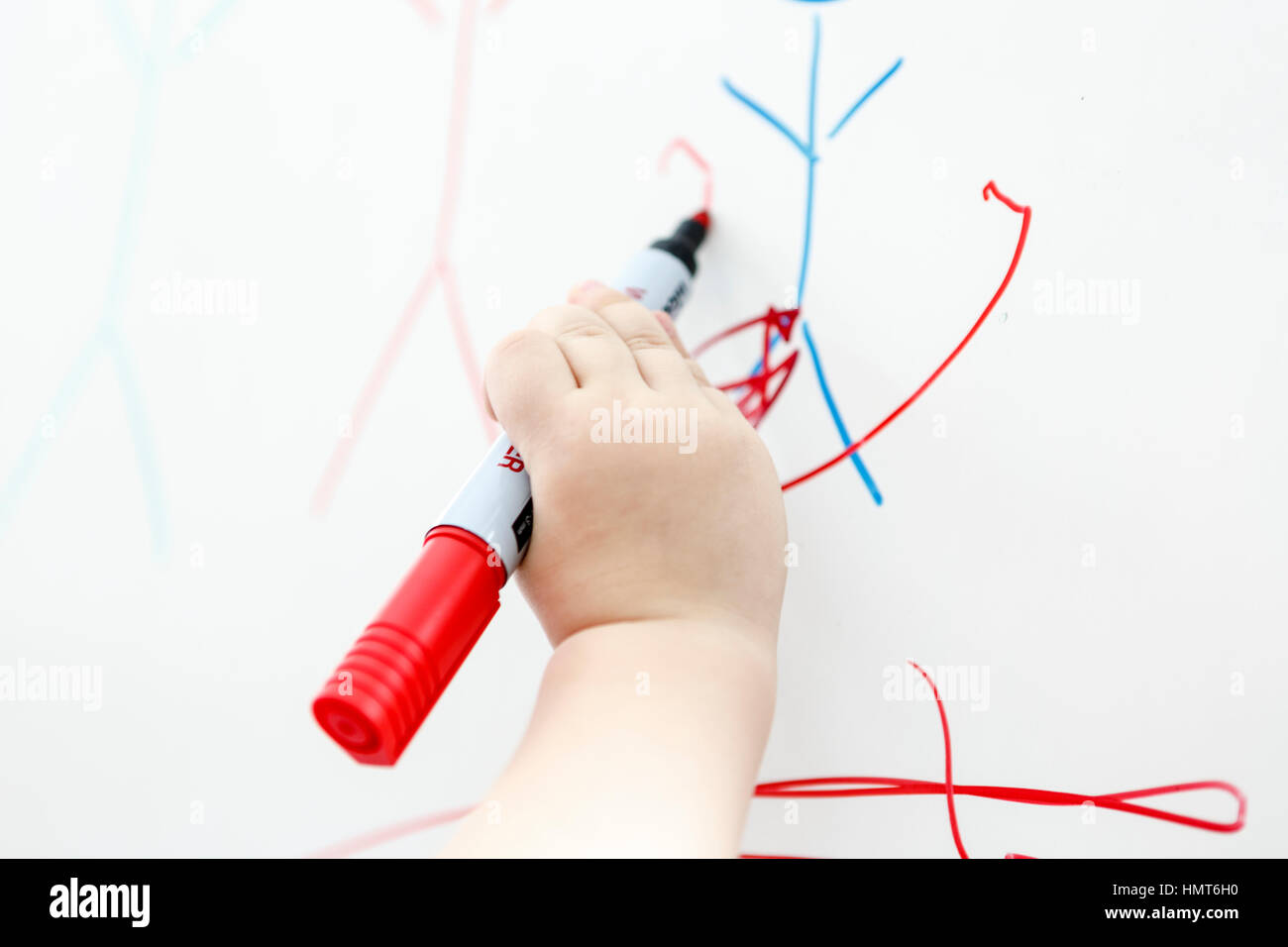 child hand drawing on white - little artist Stock Photo - Alamy
