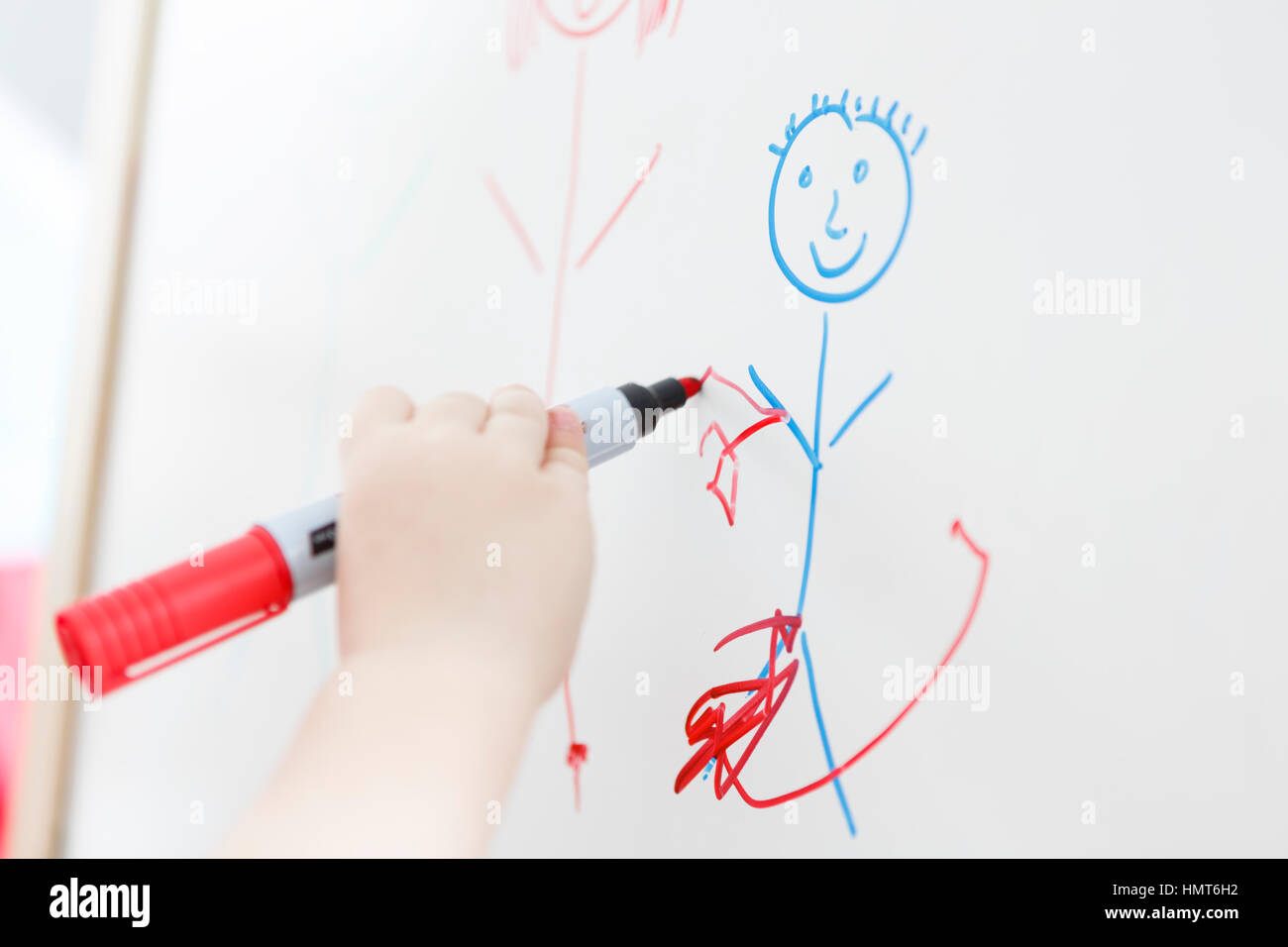child hand drawing on white - little artist Stock Photo - Alamy