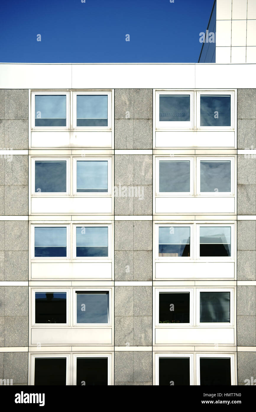 The angular external facade of a school building with large windows ...