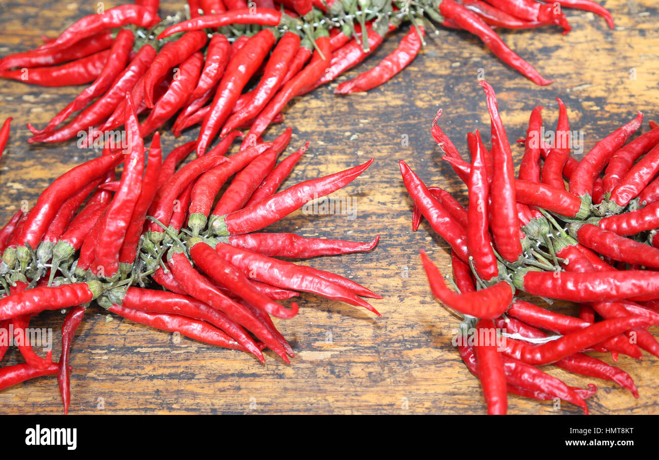 red hot peppers on wooden table of fruit and vegetable market Stock ...