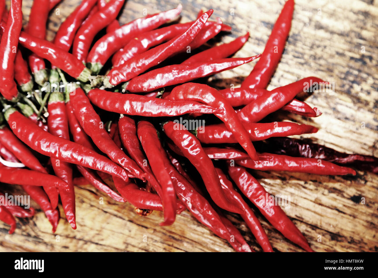 red hot peppers on wooden table of fruit and vegetable market Stock ...