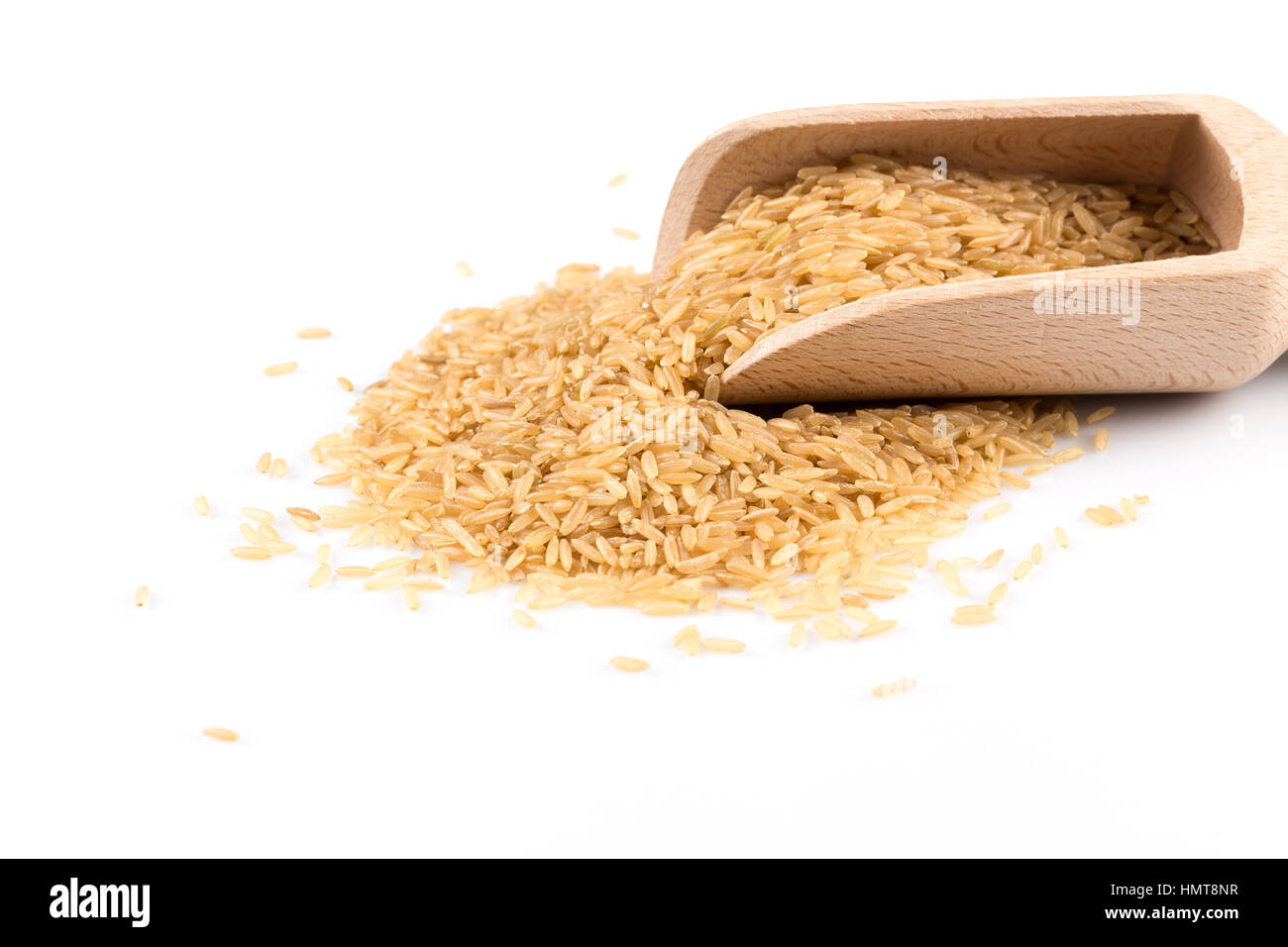 pile of brown rice isolated on white background Stock Photo - Alamy