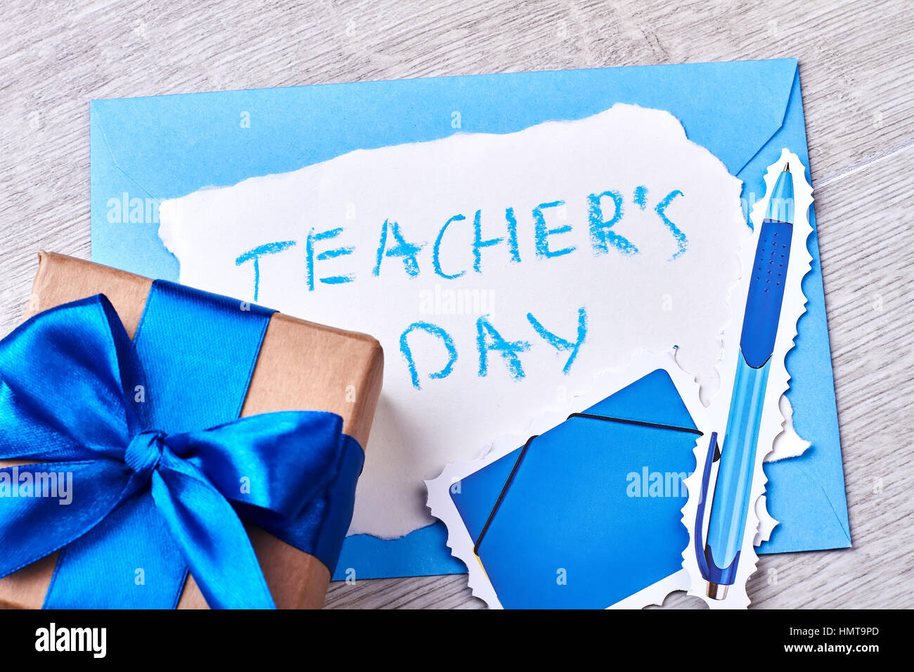 Present box with blue bow Stock Photo - Alamy