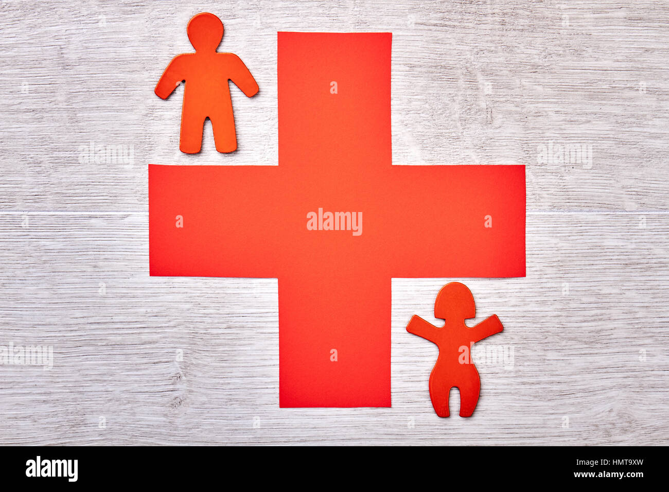 Cross and stickmen on light background Stock Photo - Alamy