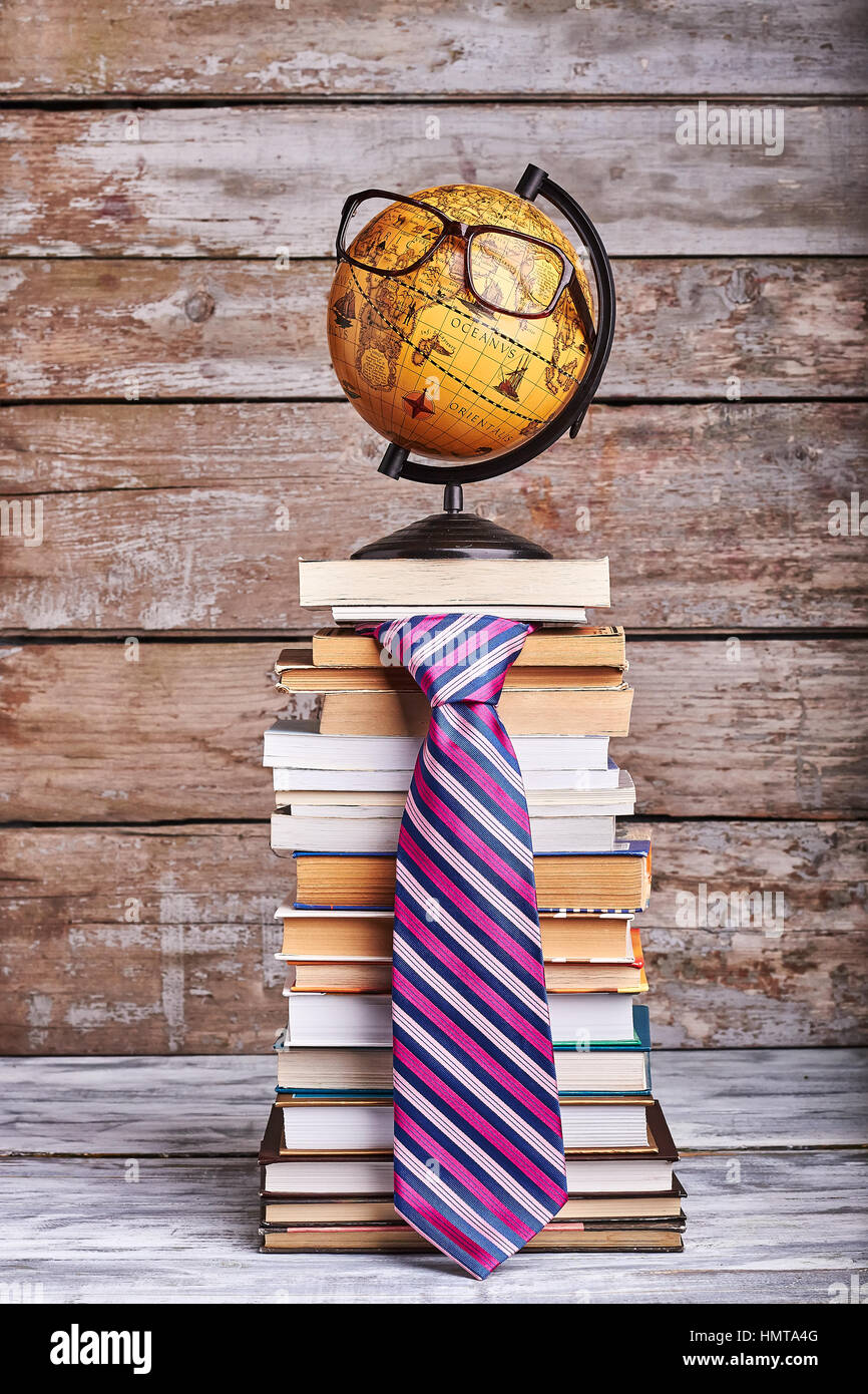 Stack of books and tie Stock Photo - Alamy