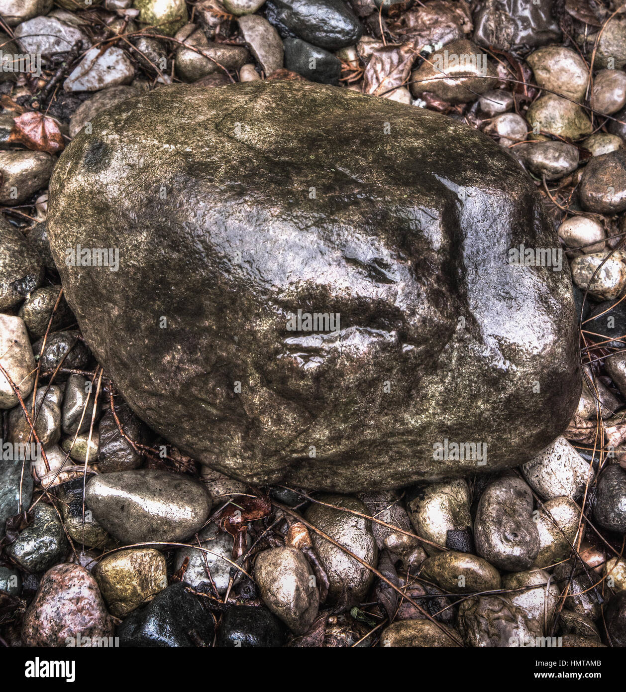 Fall rock garden plot with large and small stones Stock Photo - Alamy