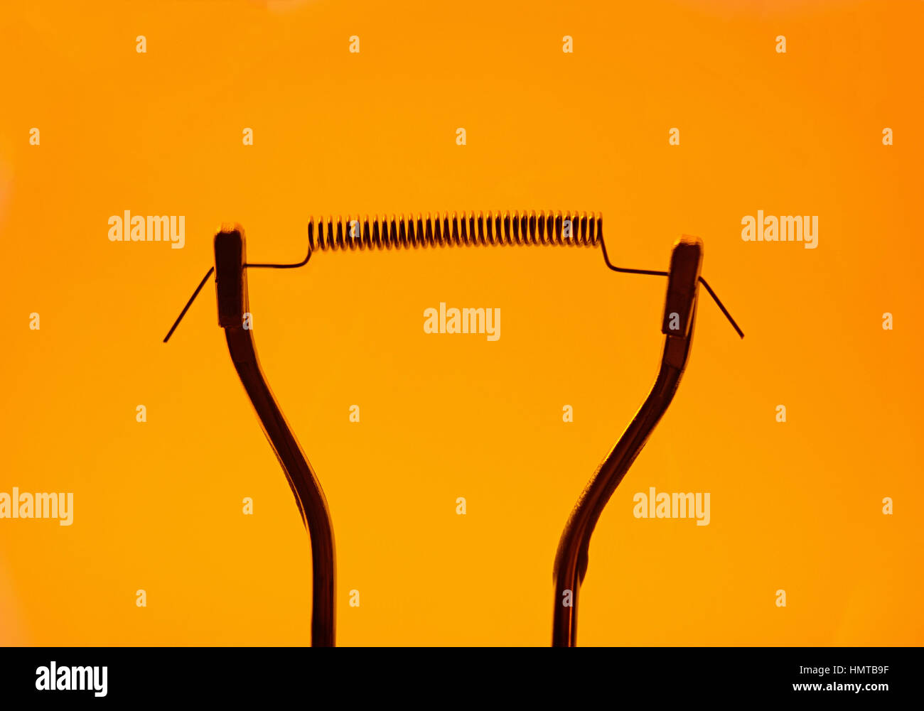 Closeup for yellow incandescent lighted bulb Stock Photo - Alamy