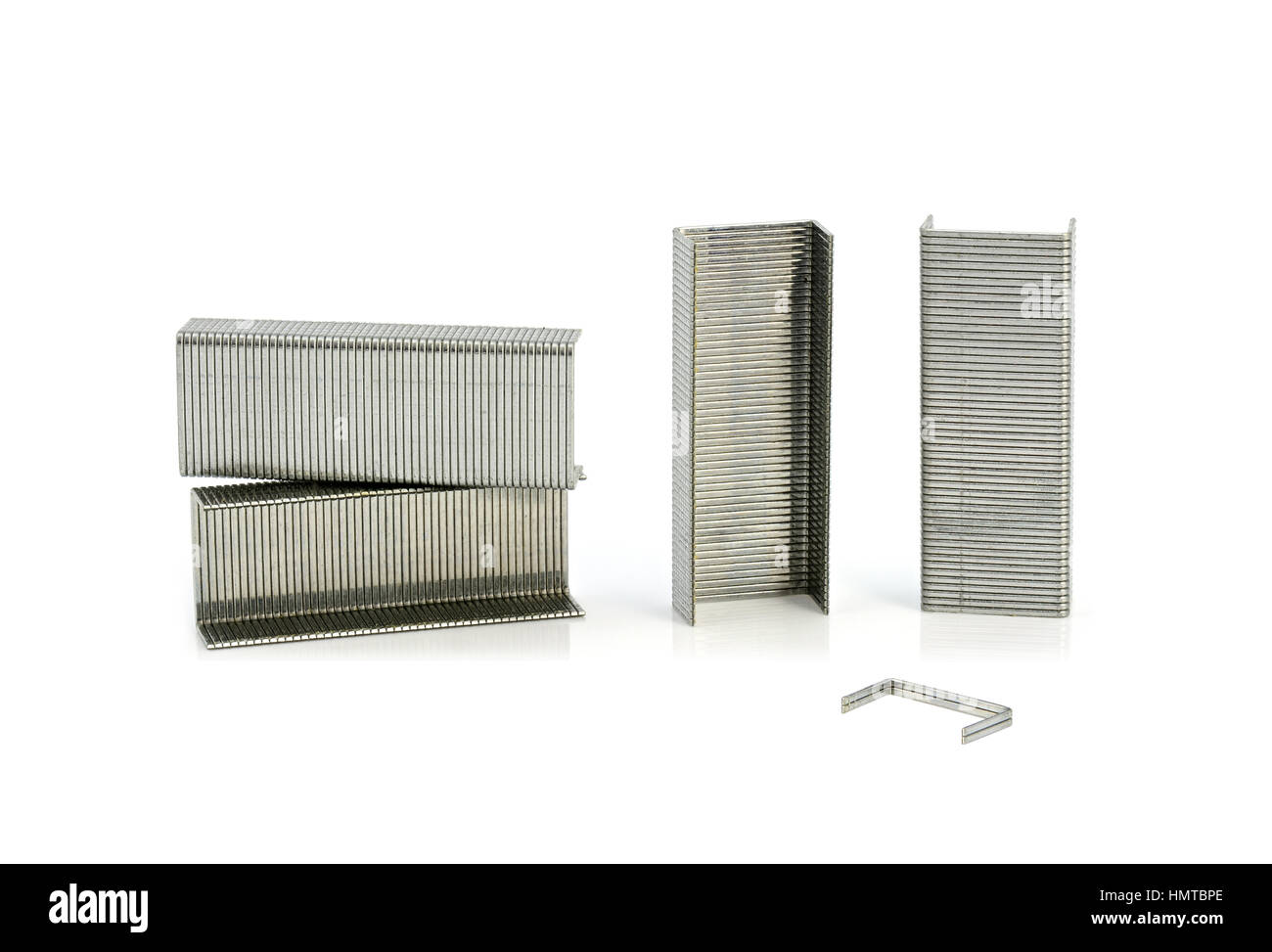 Stack of metal staples on a white background Stock Photo - Alamy