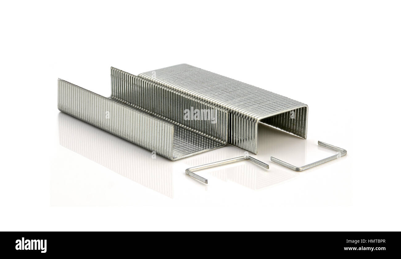 Stack of metal staples on a white background Stock Photo - Alamy