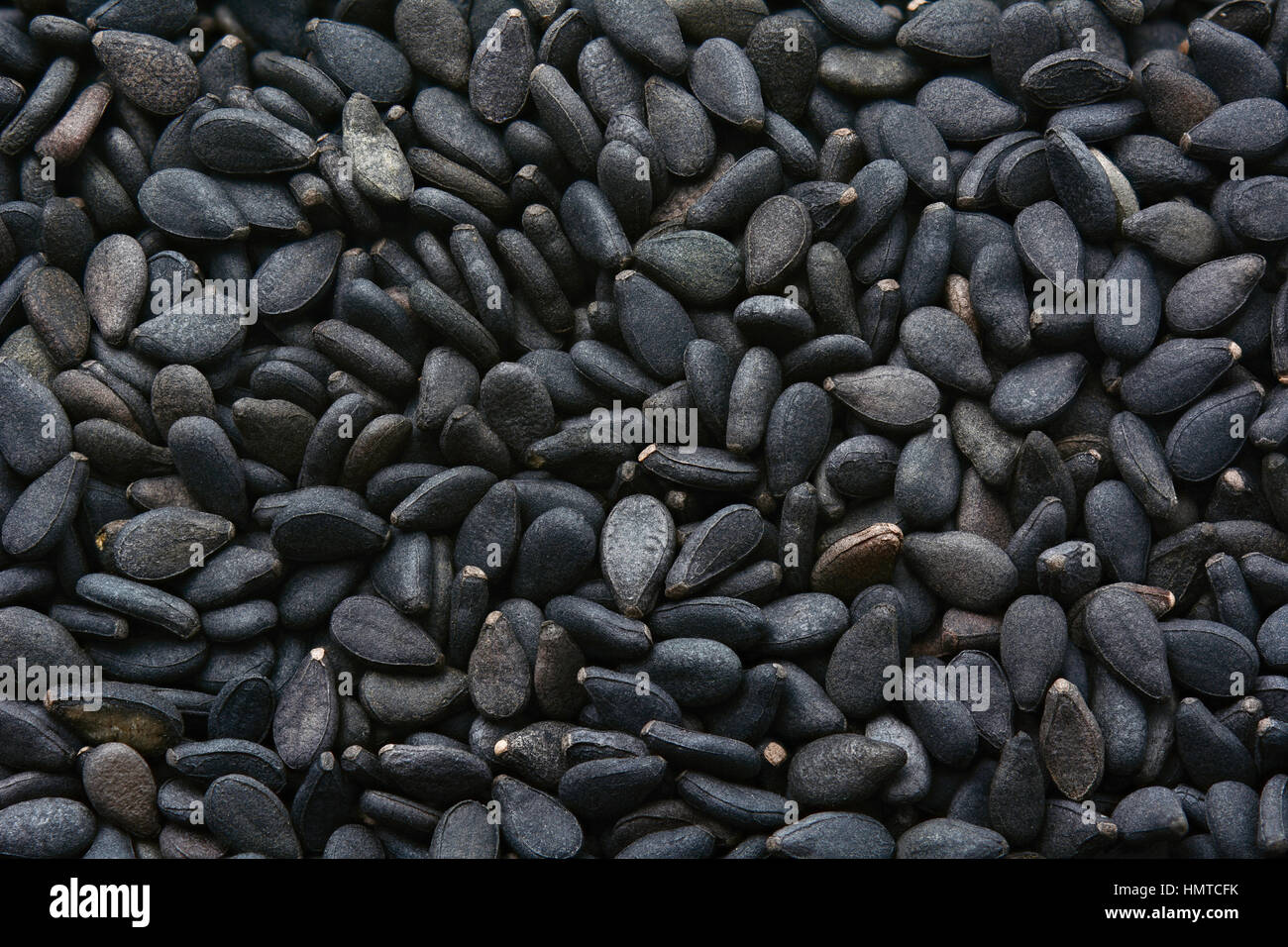 Closeup of black sesame seeds use for background Stock Photo - Alamy
