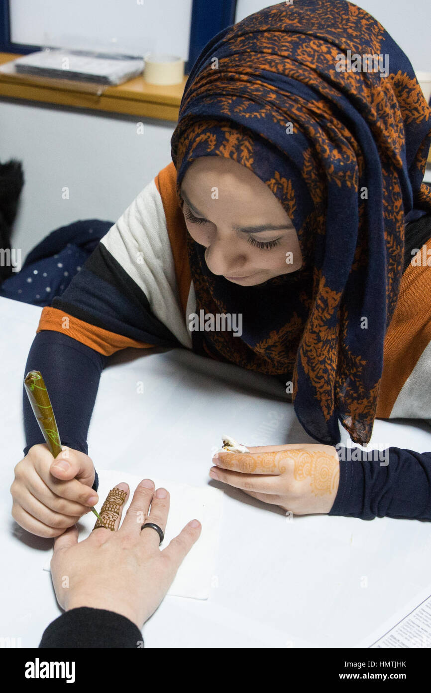 Slough, UK. 5th February, 2017. A woman sits for a henna tattoo at Al ...