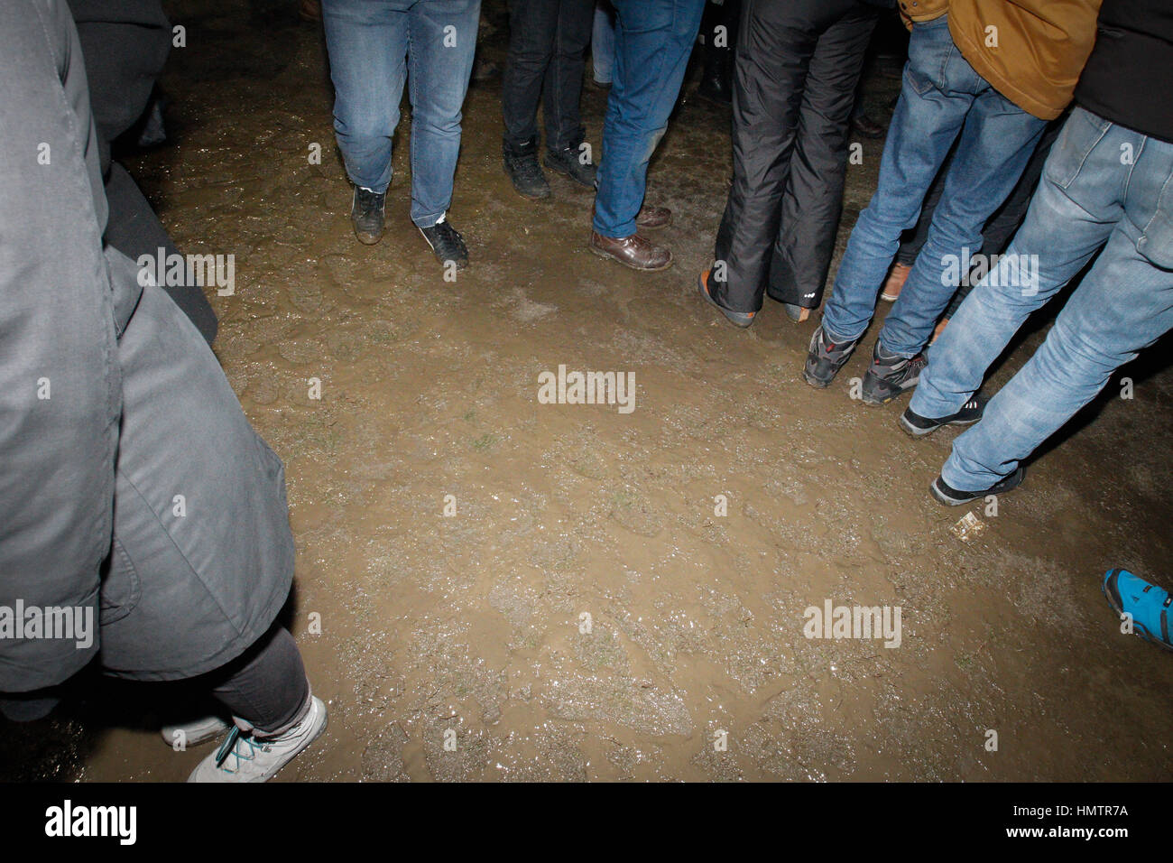 Romania. 5th Feb, 2017. People are seen standing in the mud during ...