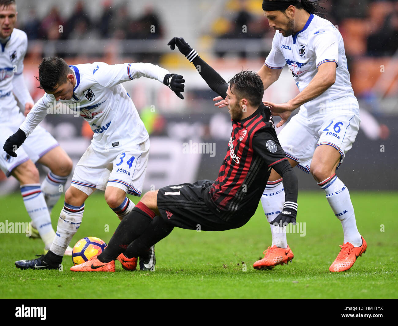 Milan, Italy. 5th Feb, 2017. AC Milan's Andrea Bertolacci (C) vies with ...
