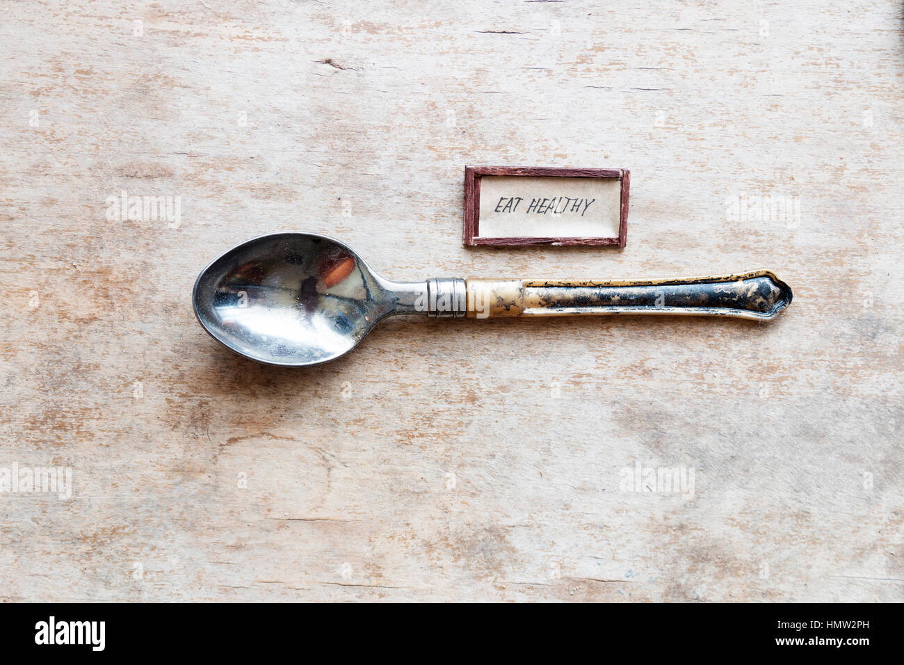 Diet, dieting vintage concept. Eat Healthy text and empty spoon Stock ...