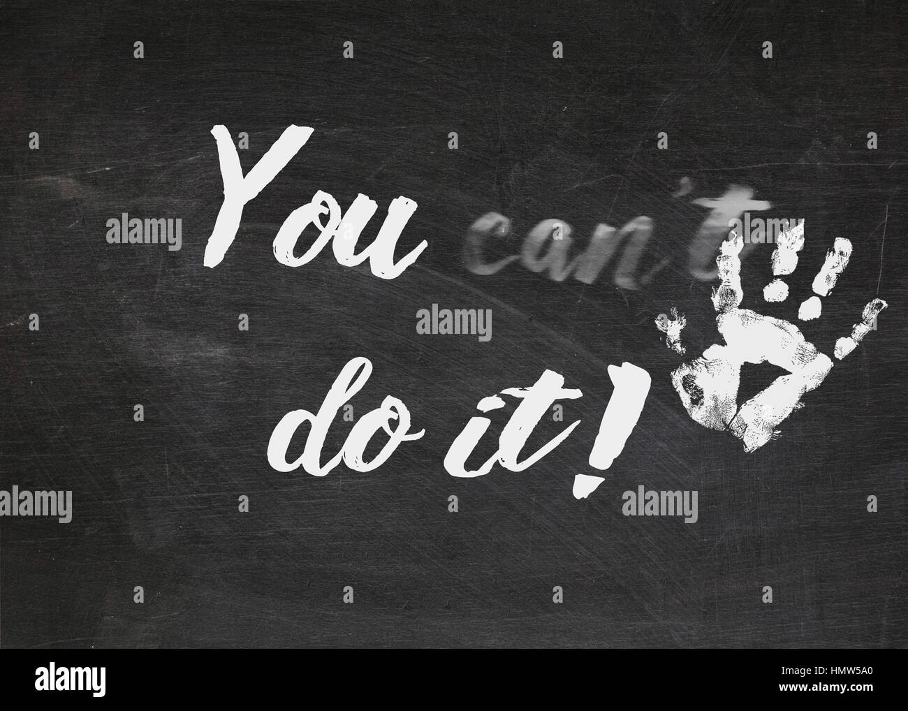 motivation message on black chalkboard with hand print Stock Photo - Alamy