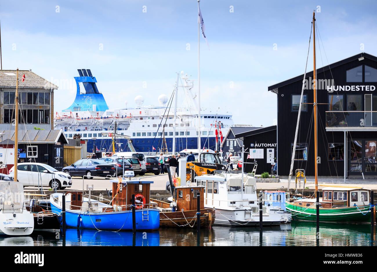 fishing boats and a cruise ship in Hundested harbour, Denmark Stock ...