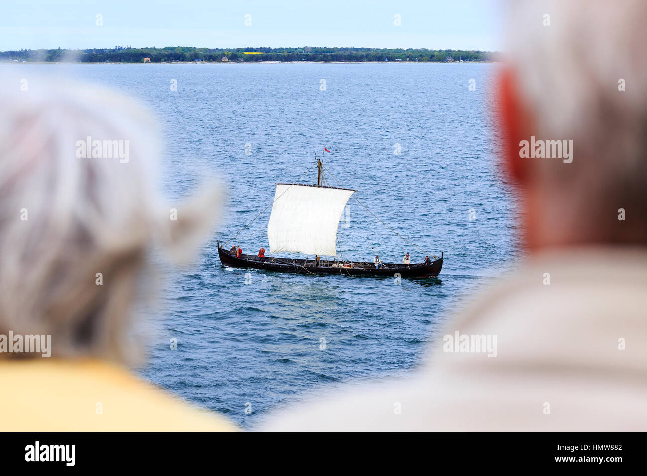 Viking sailing long boat on the sea, Hundested, Denmark with a couple ...