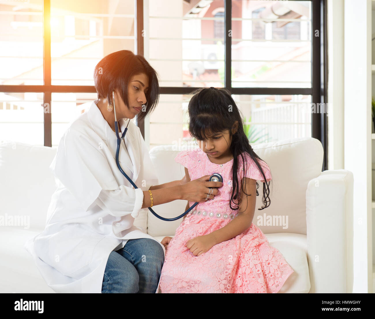 Indian female doctor treating young hi-res stock photography and images ...