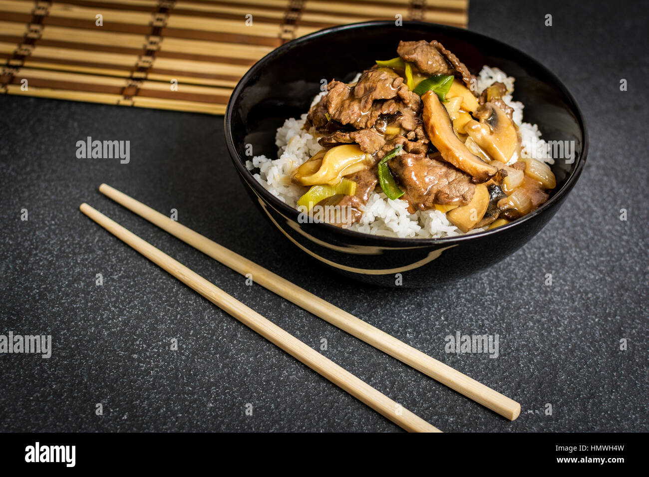 Chinese rice with beef meat and vegetagles on dark background Stock ...