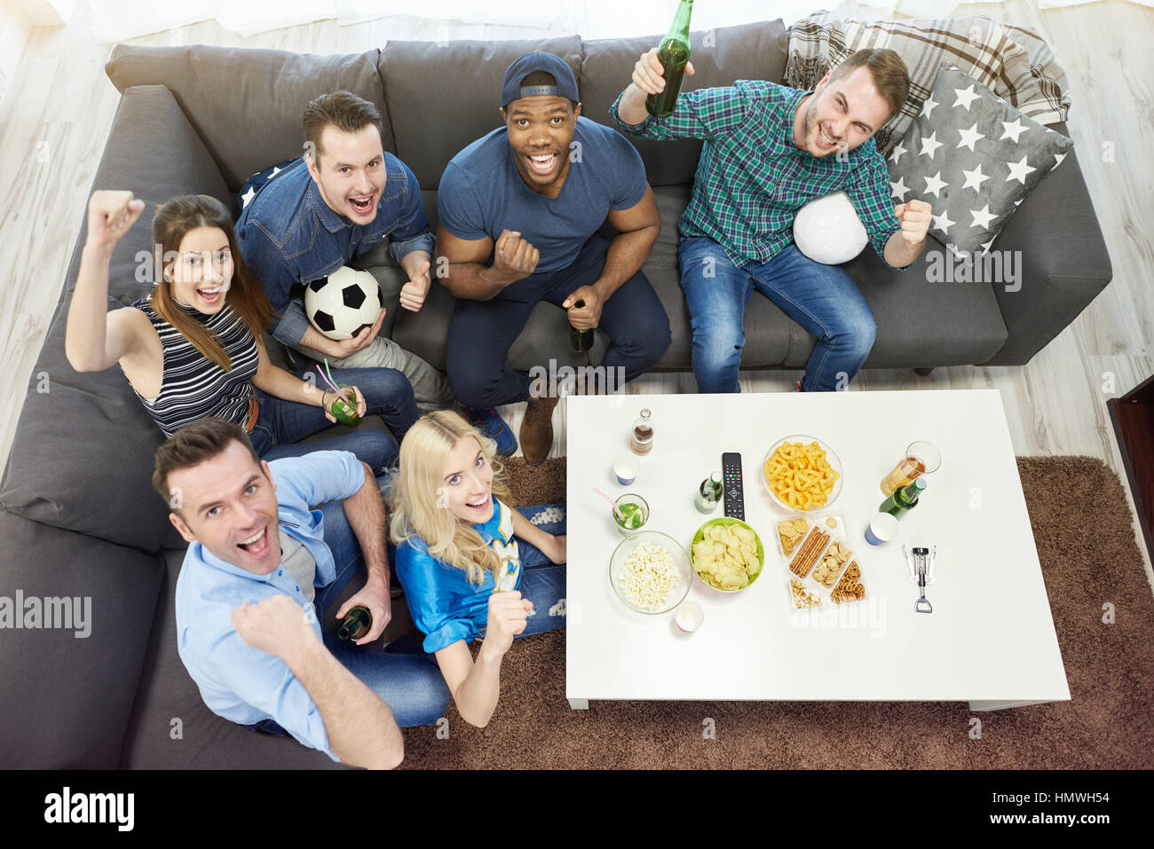 All of best friends watching football match Stock Photo - Alamy