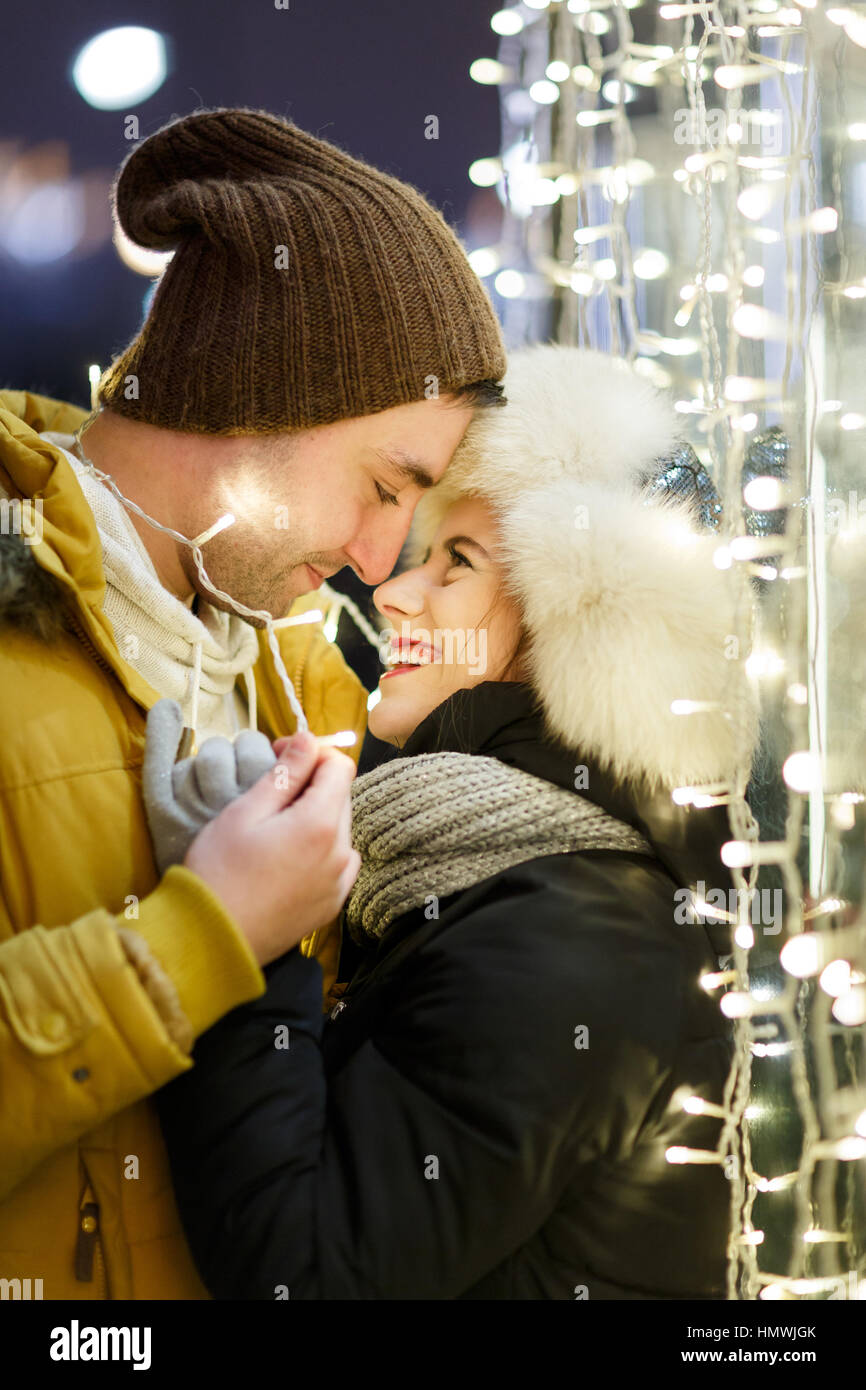 Smiling lovers on romantic meeting in winter city Stock Photo - Alamy
