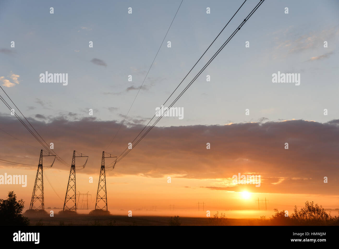 Power lines on background of purple sky during sunset Stock Photo - Alamy