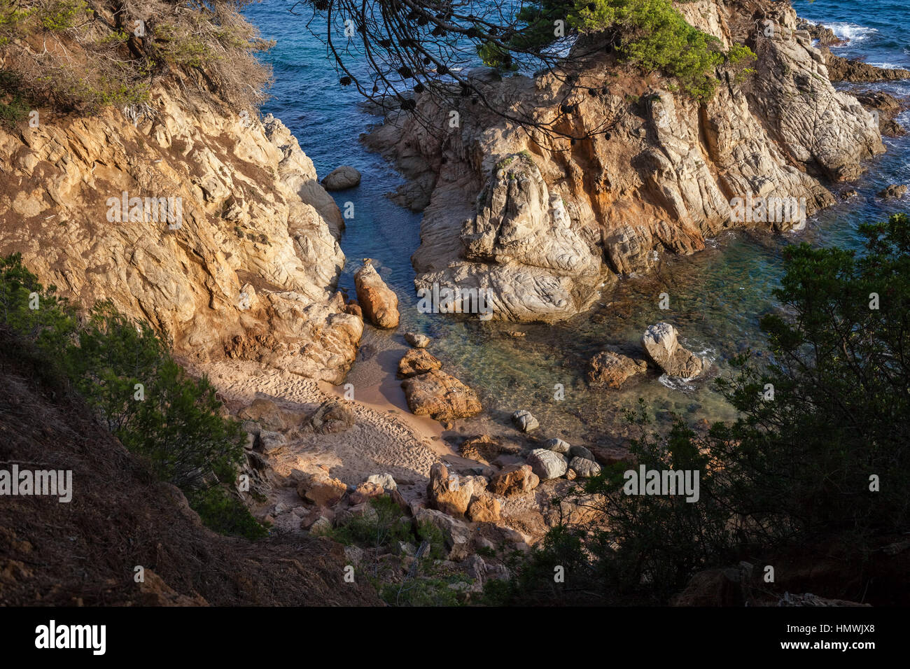 Small hidden secluded beach below a cliff at Mediterranean Sea ...