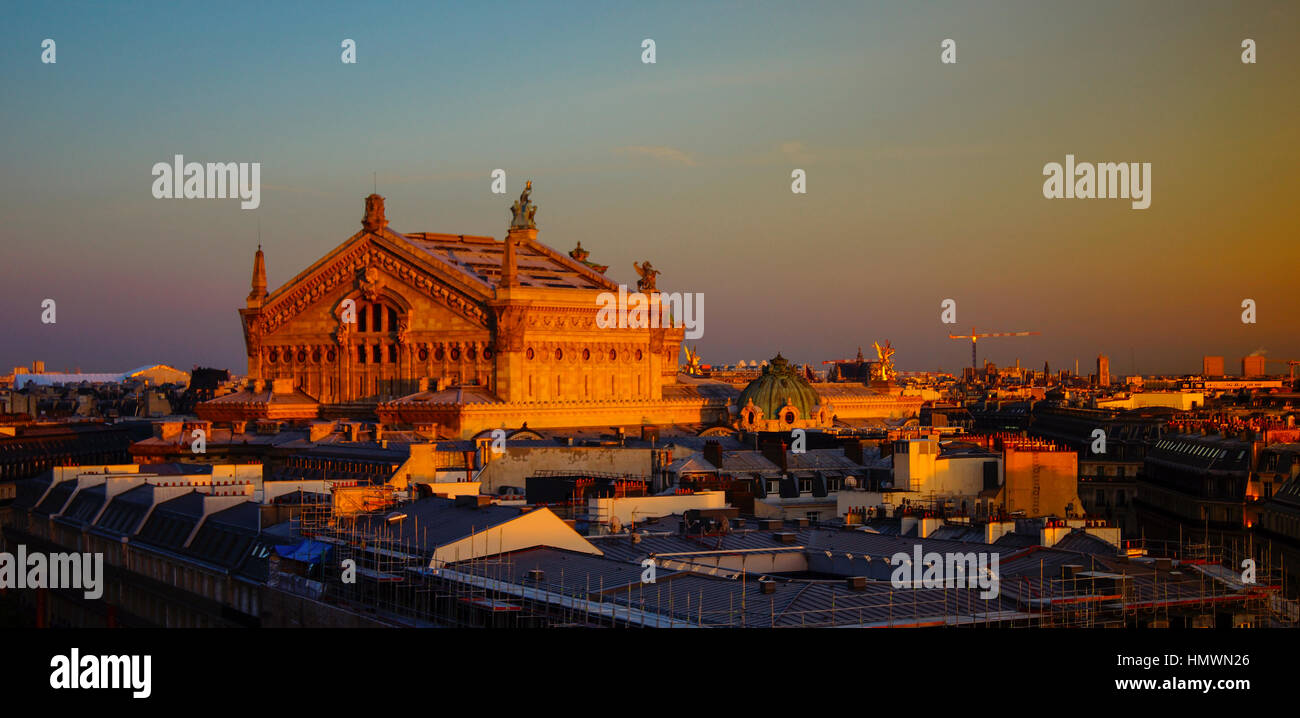 Traffic cars in front of Opera, Paris. The Palais Garnier is a 1,979 ...