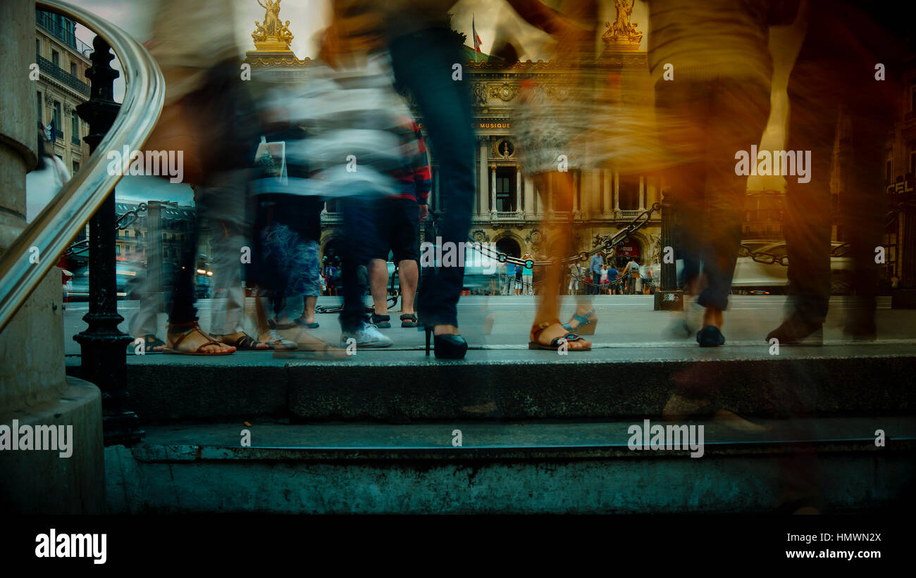 Traffic cars in front of Opera, Paris. The Palais Garnier is a 1,979 ...
