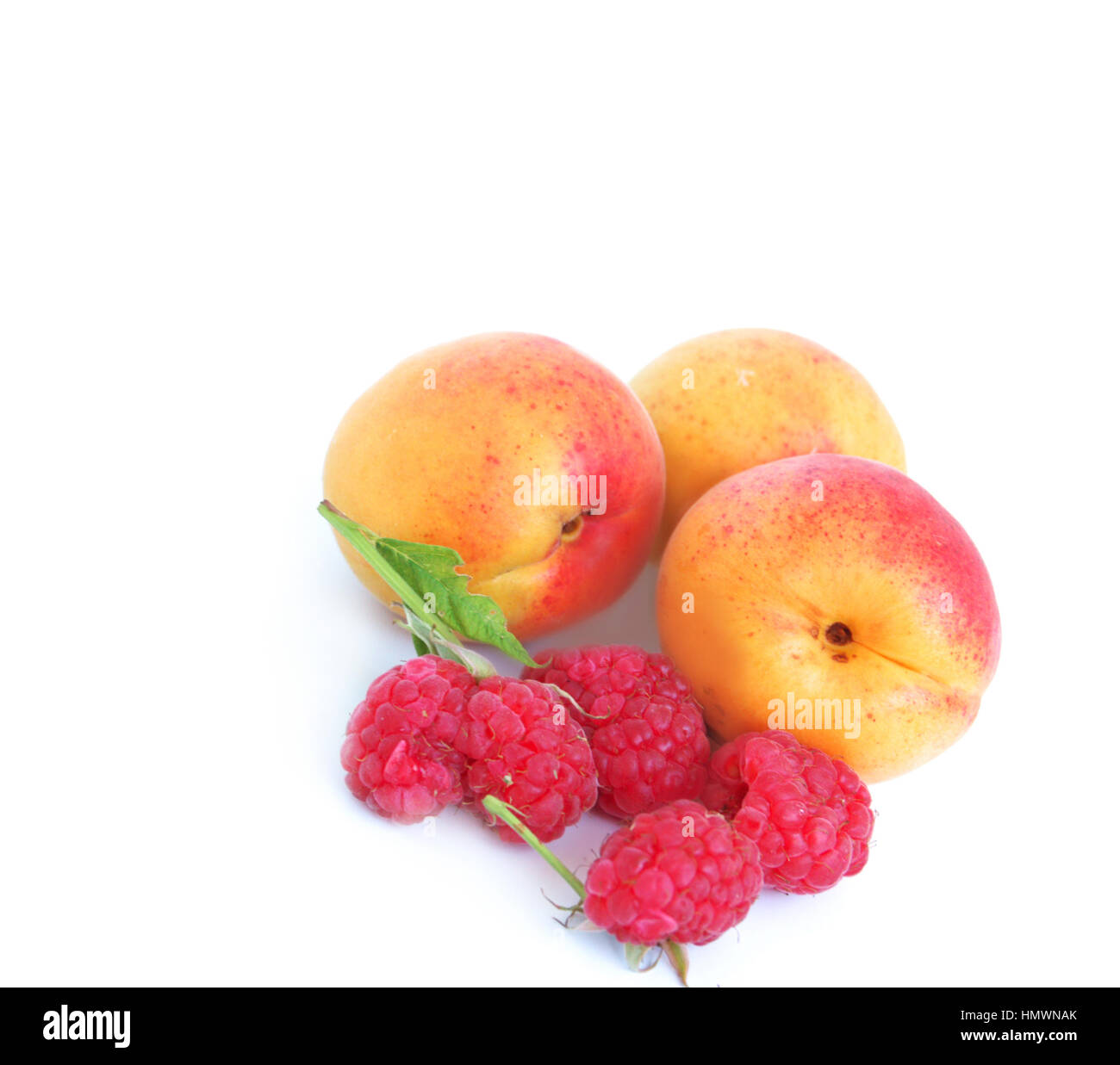 Peaches and berrys on white background Stock Photo - Alamy