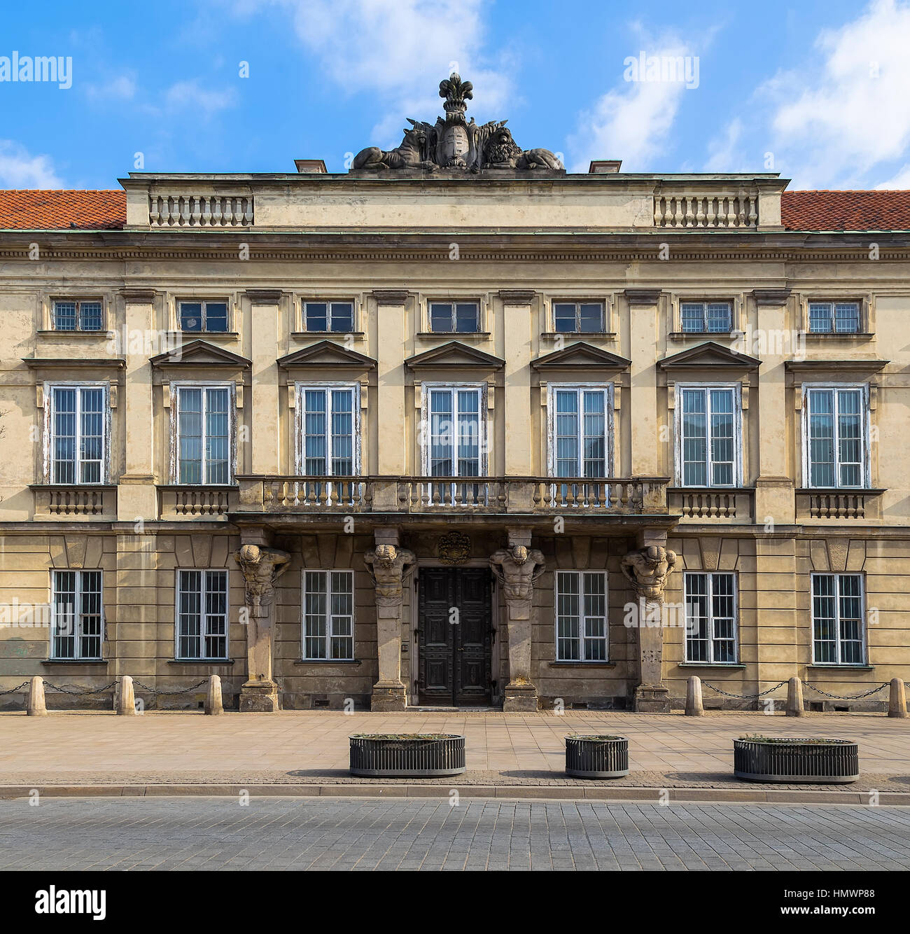 Facade of a beautiful old building and a balcony with the Atlanteans ...