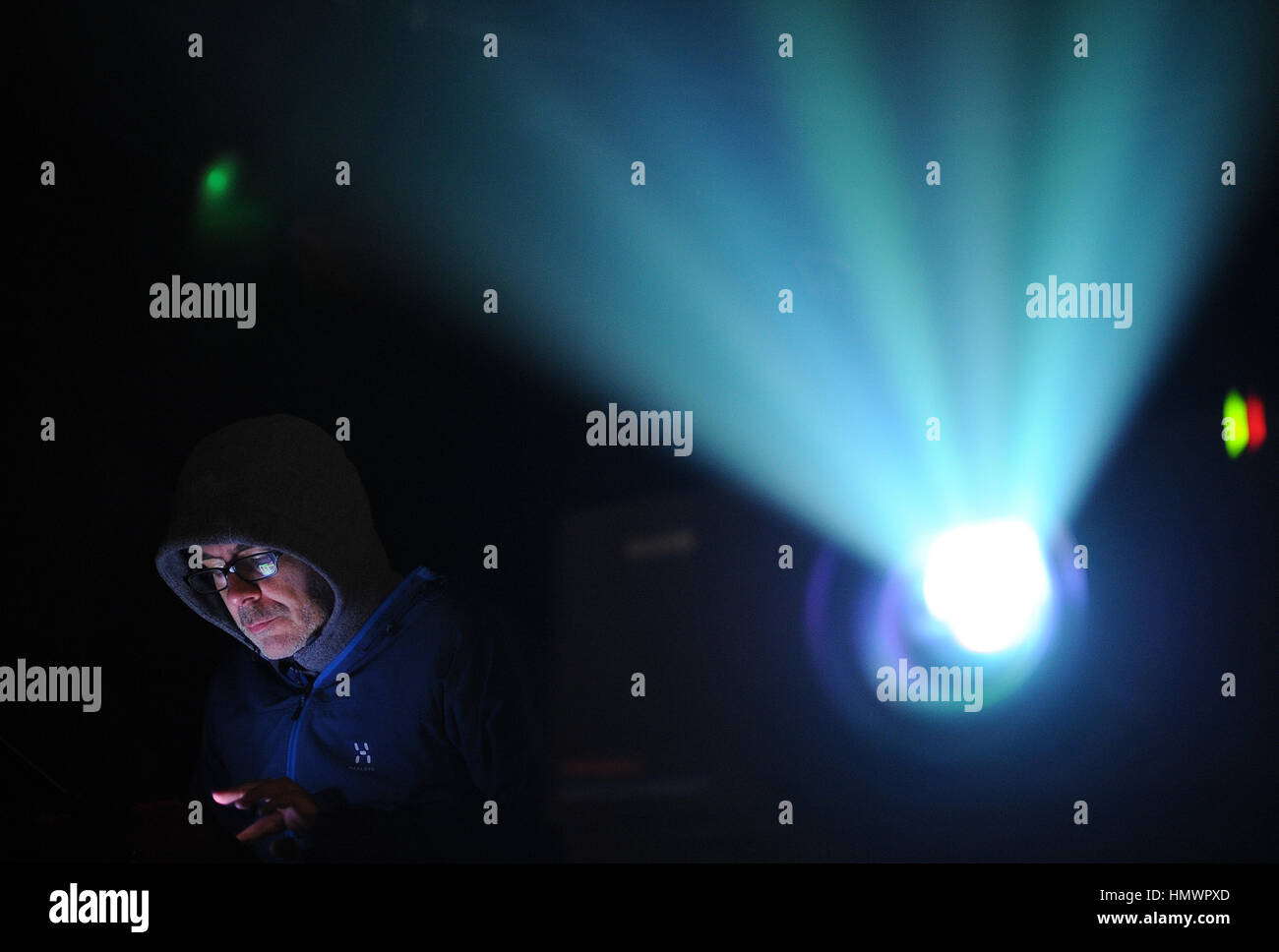 Artist Benjamin Rabe projecting images from his iPad onto the side of ...