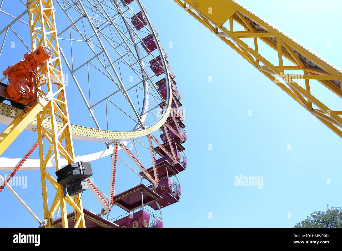 Detail photo of rotating round multicolored ferris wheel with cabins in ...
