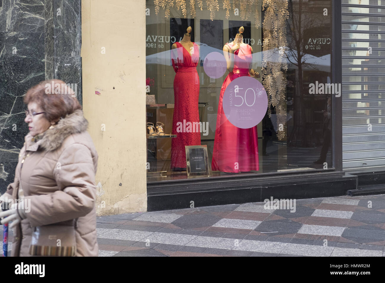 A shop front sign announces discounts on the first day of the winter ...