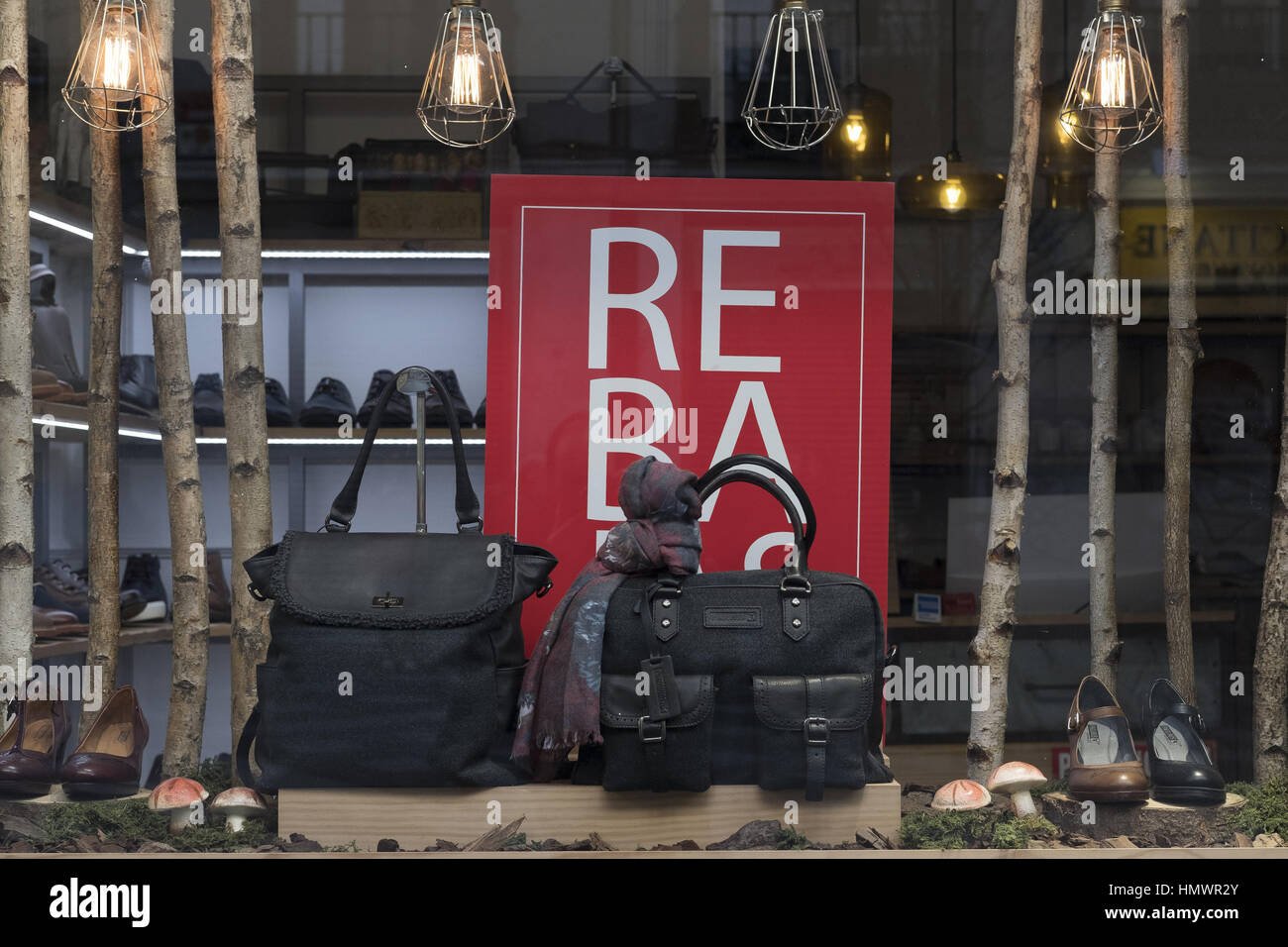 A shop front sign announces discounts on the first day of the winter ...