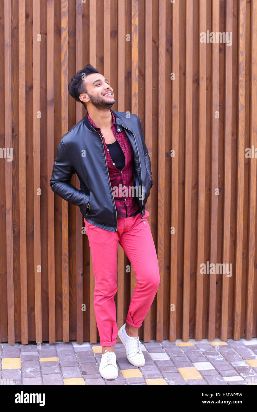 Man Muslim appearance standing and enjoys life, smiles broadly and ...