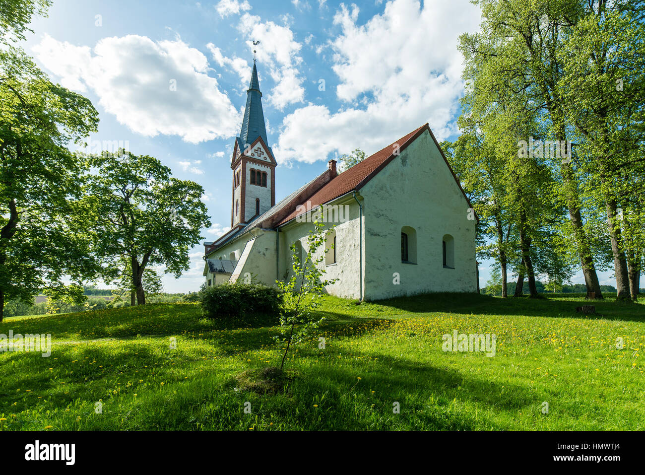 countryside church building in summer in small village Stock Photo - Alamy