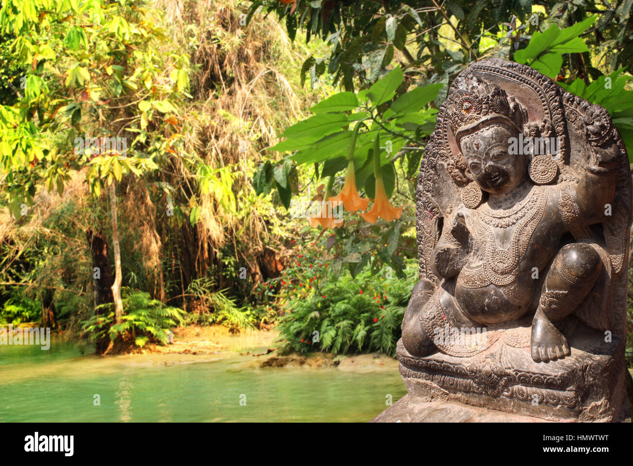Stone sculpture of dancing hindu god and trees in rainforest Stock ...