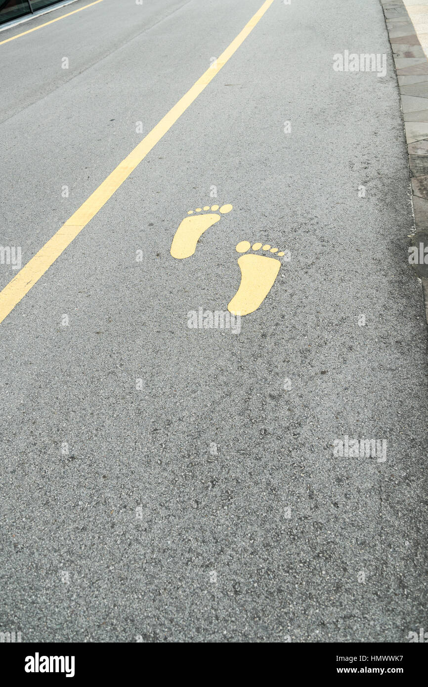 symbol of foot walk lane on road Stock Photo - Alamy