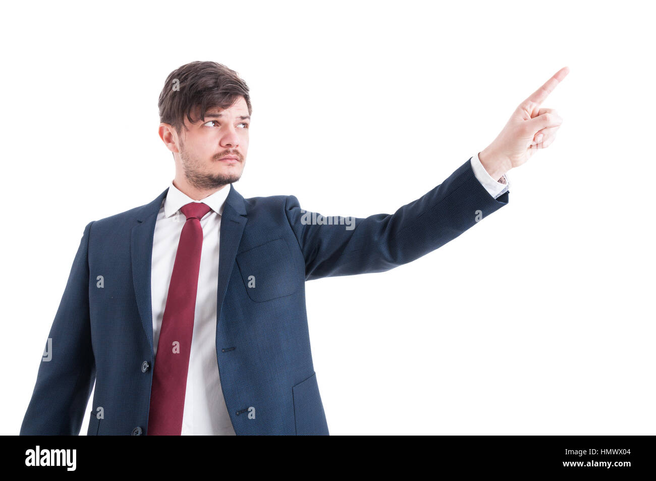 Portrait of business man showing something with index finger isolated ...