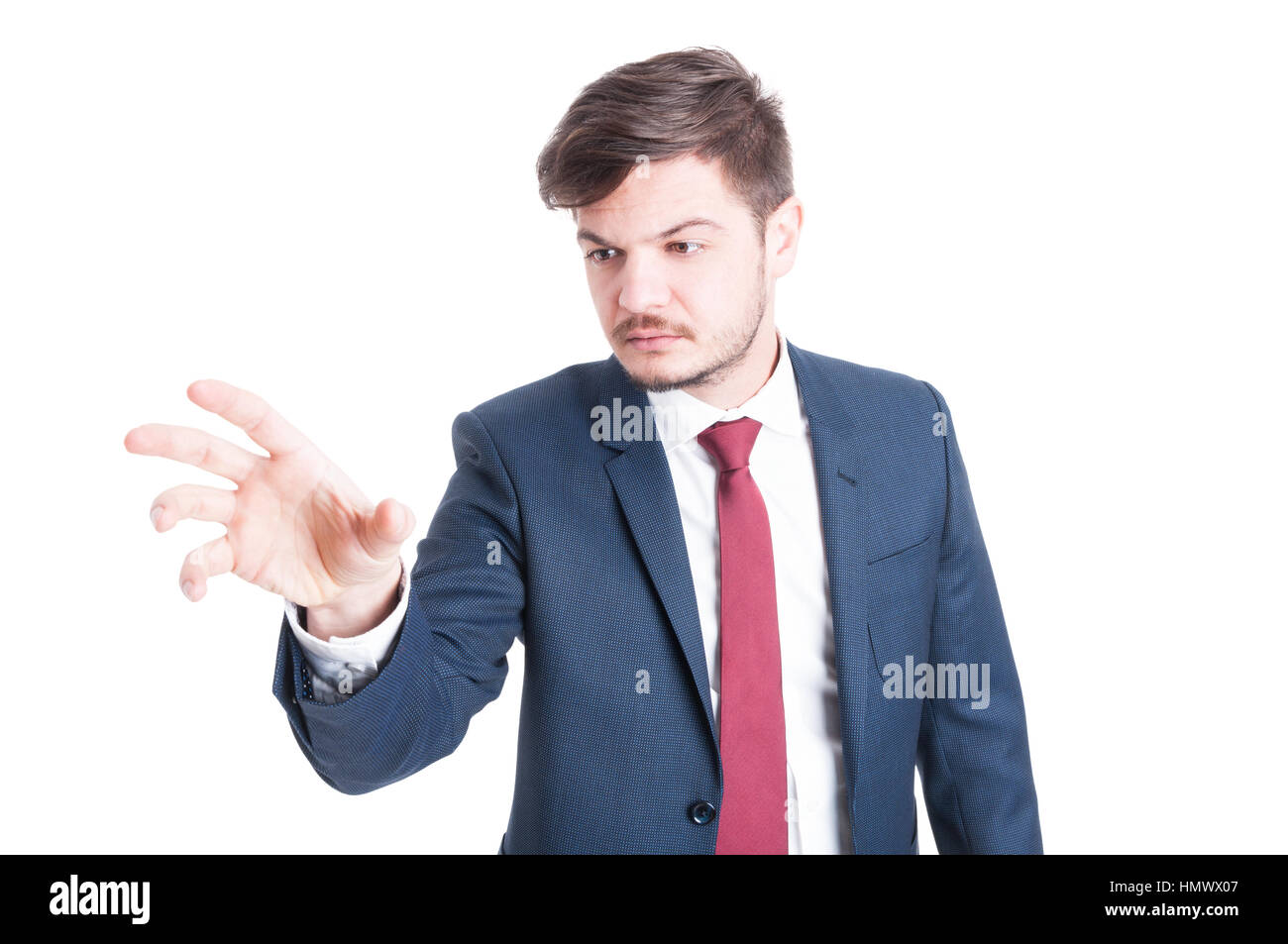 Business man standing and grabbing something isolated on white ...