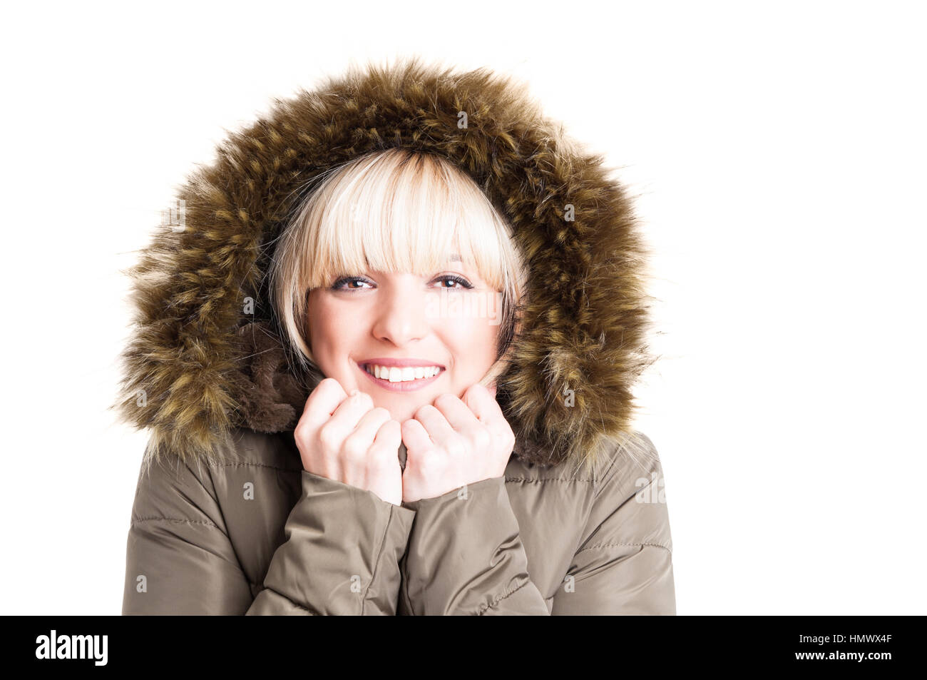 Portrait of woman wearing winter jacket with hood being cold isolated ...