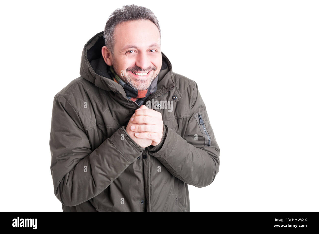 Man posing like being cold wearing winter casual clothes and smiling ...