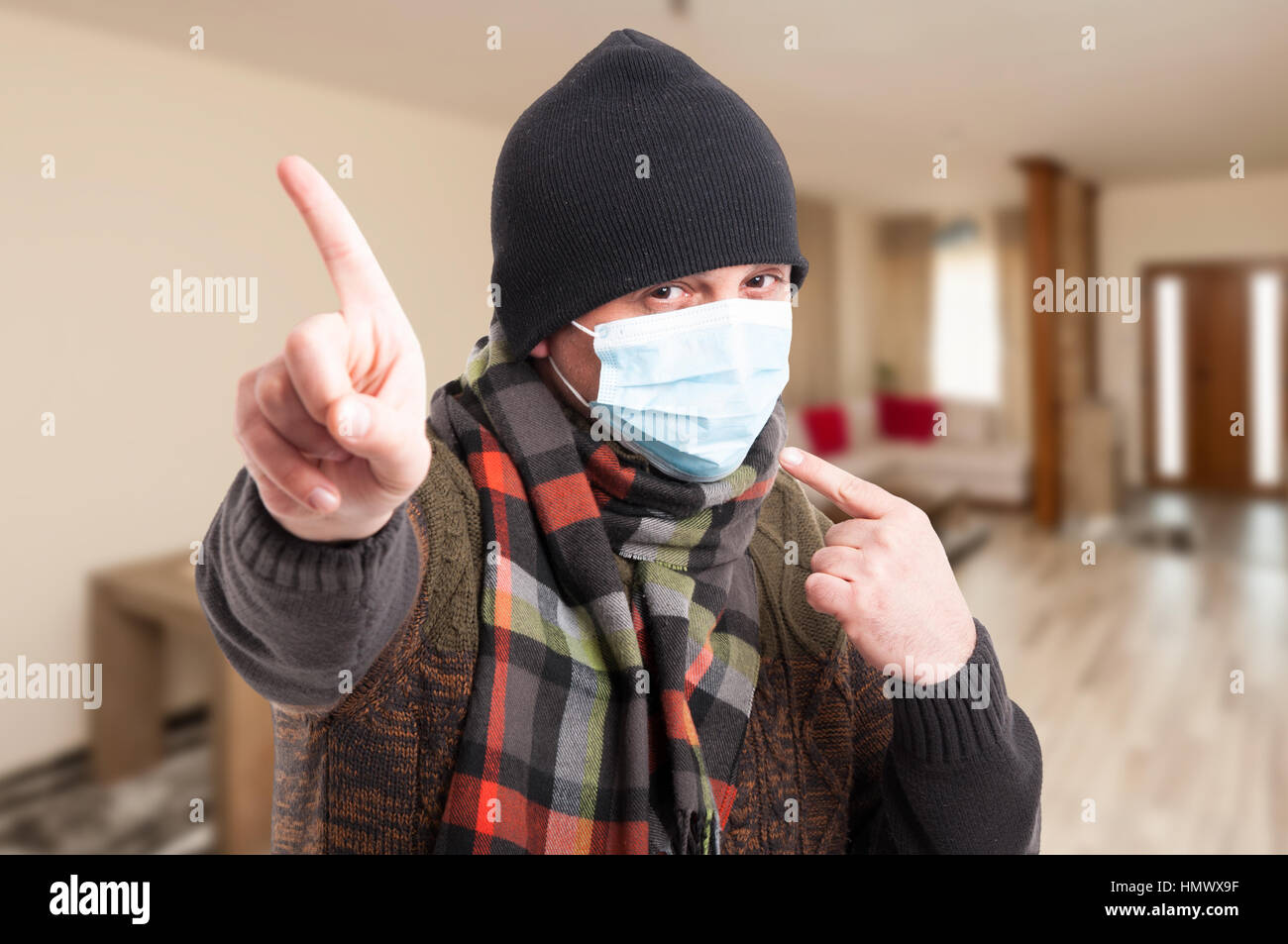 Man wearing medical mask as protection against flu or influenza in ...