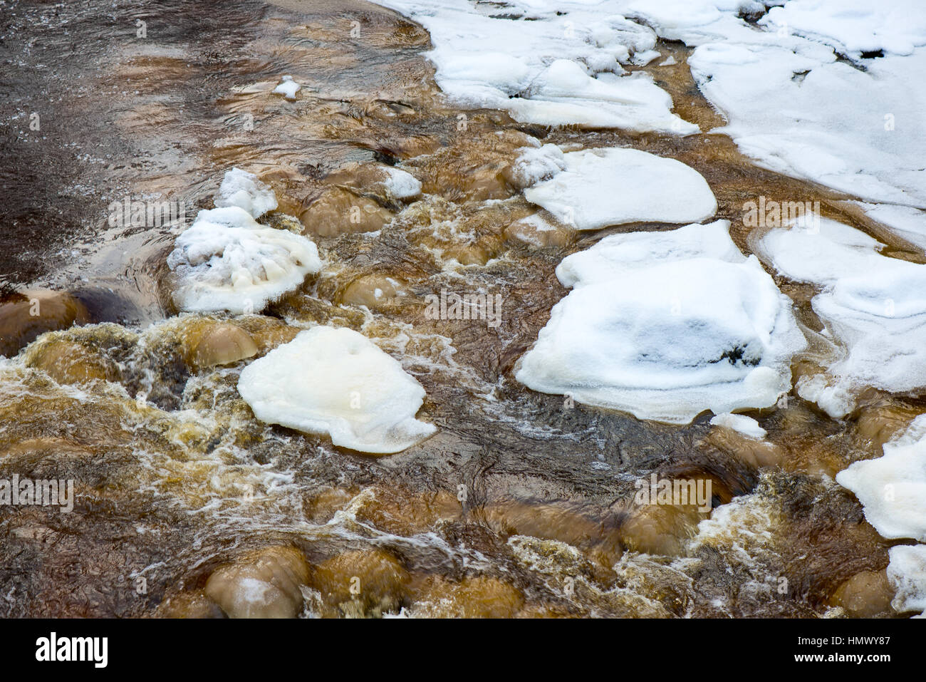 abstract frozen ice textures in the forest country river in winter ...