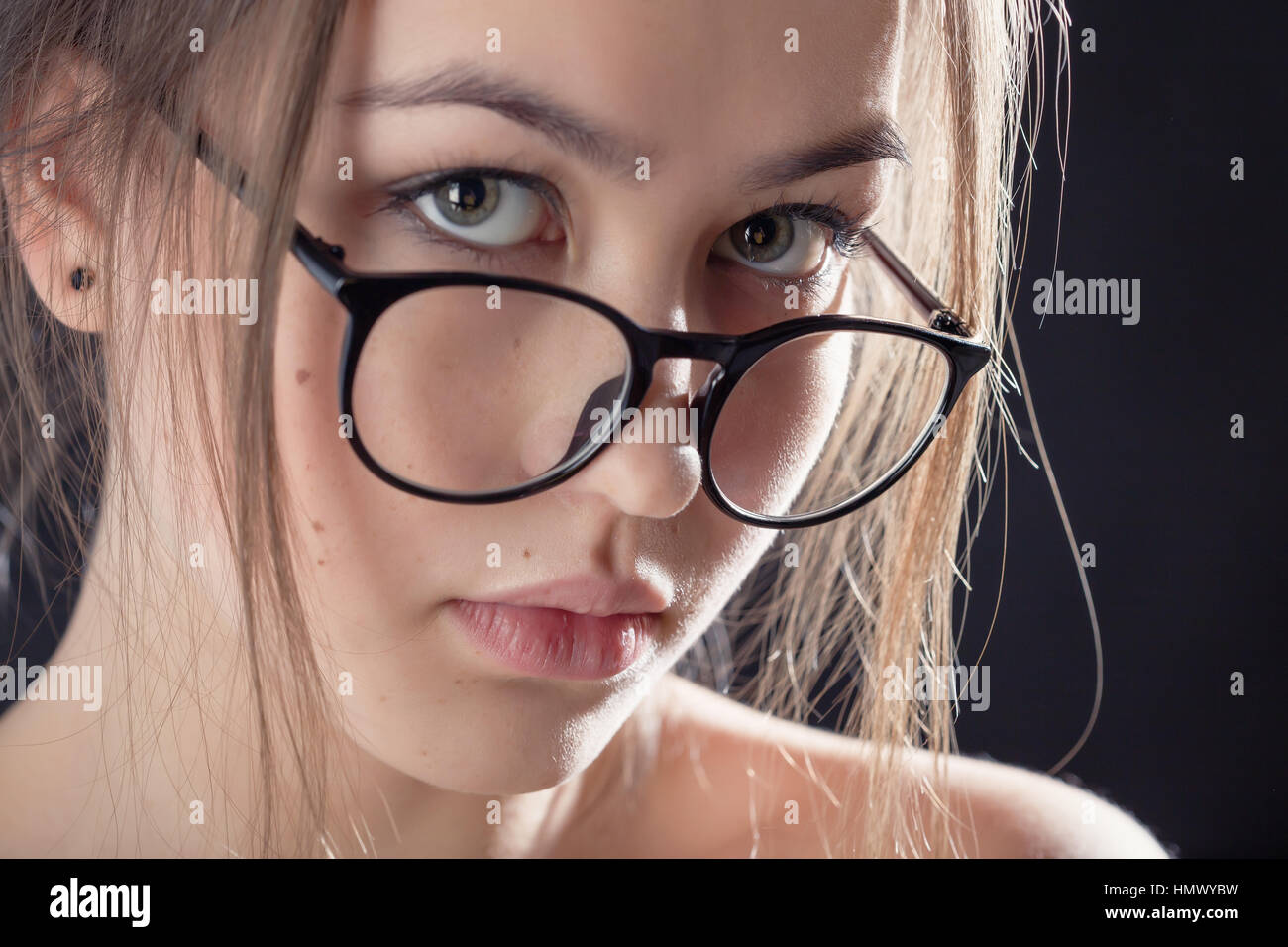 beautiful sad girl portrait on black background Stock Photo - Alamy