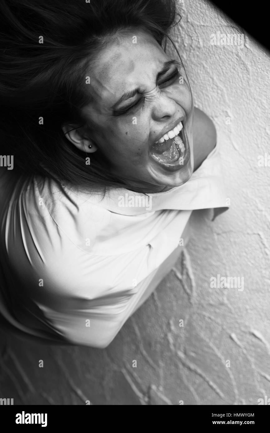 screaming crazy woman in straitjacket, monochrome Stock Photo - Alamy