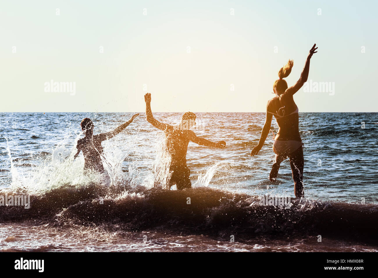 Friends fun party beach sunset group Stock Photo - Alamy