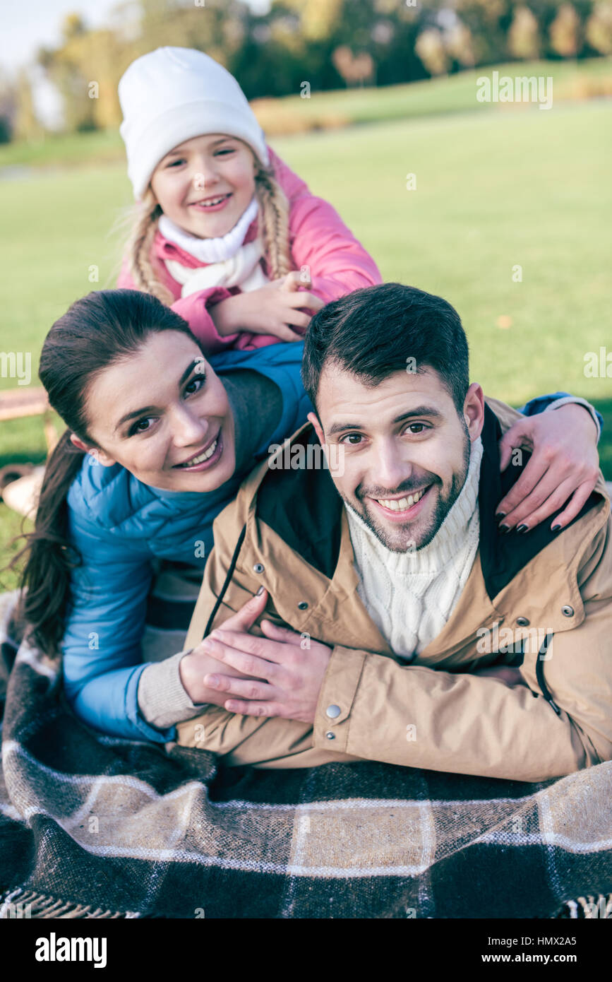 Happy family hugging and having fun Stock Photo - Alamy